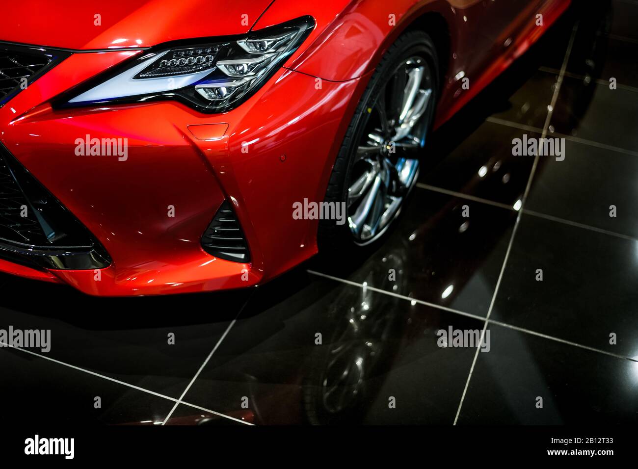 Brand new red Lexus RC car in the showroom Stock Photo - Alamy