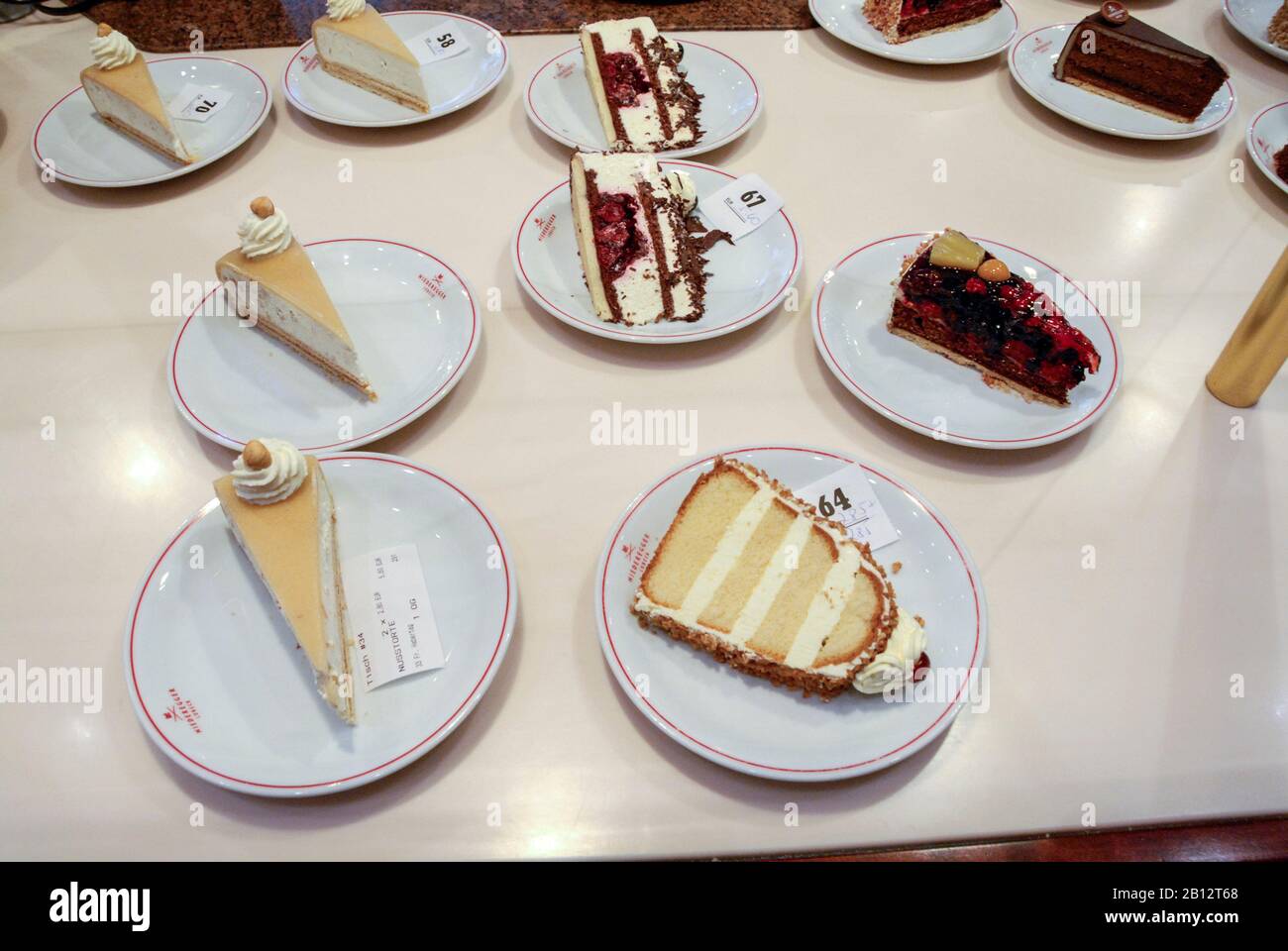 A selection of marzipan and cream filled cakes on display inside Café ...