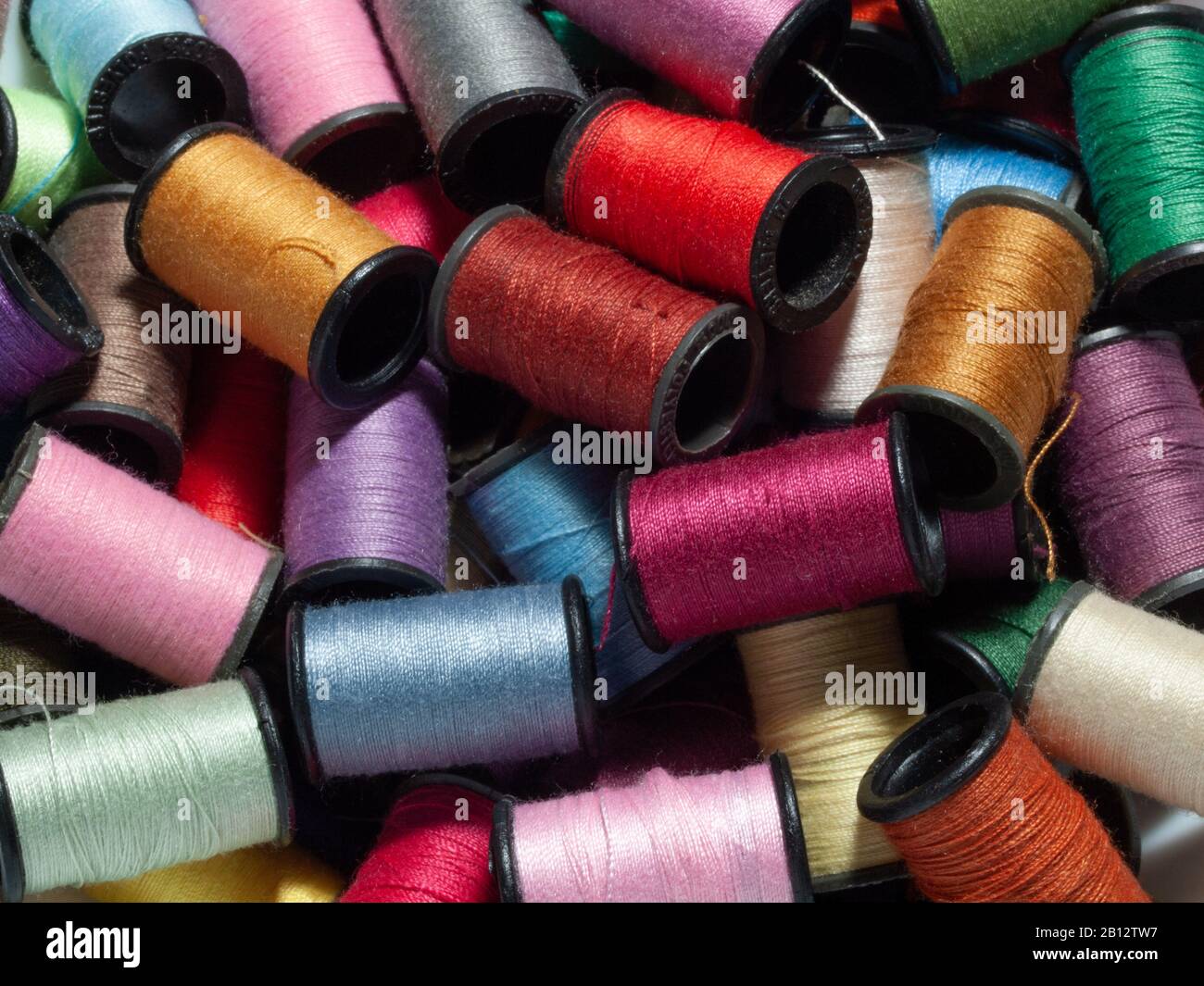 Colorful assorted reels of cotton thread Stock Photo - Alamy