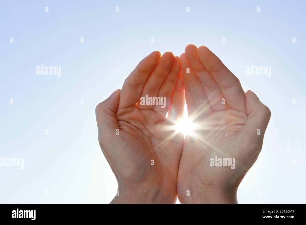 Hands catching light,sun Stock Photo - Alamy