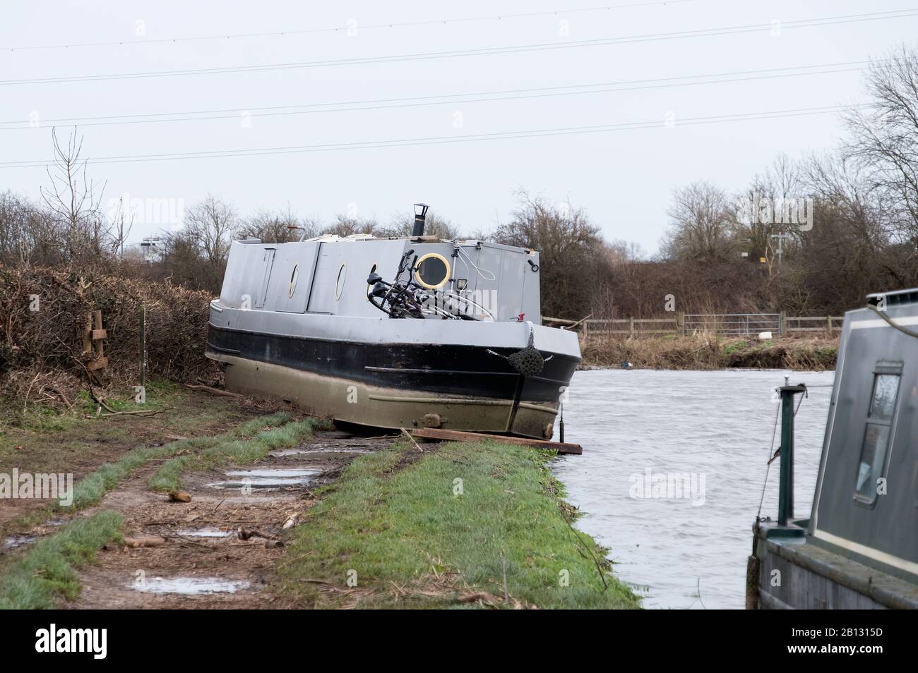 Canal narrow boat left stranded after flooding during Storm Dennis ...
