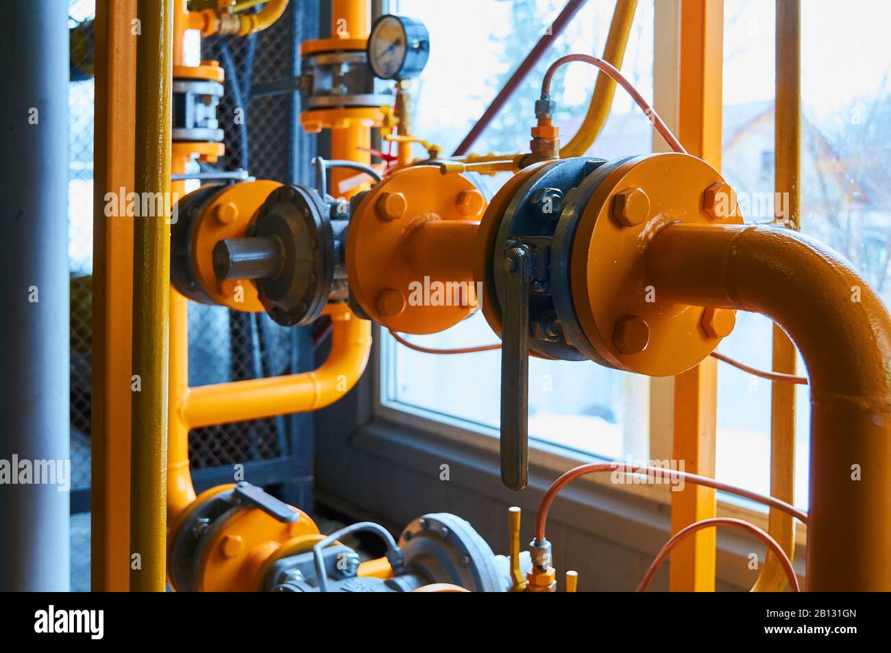 Latch on a yellow gas supply line Stock Photo - Alamy