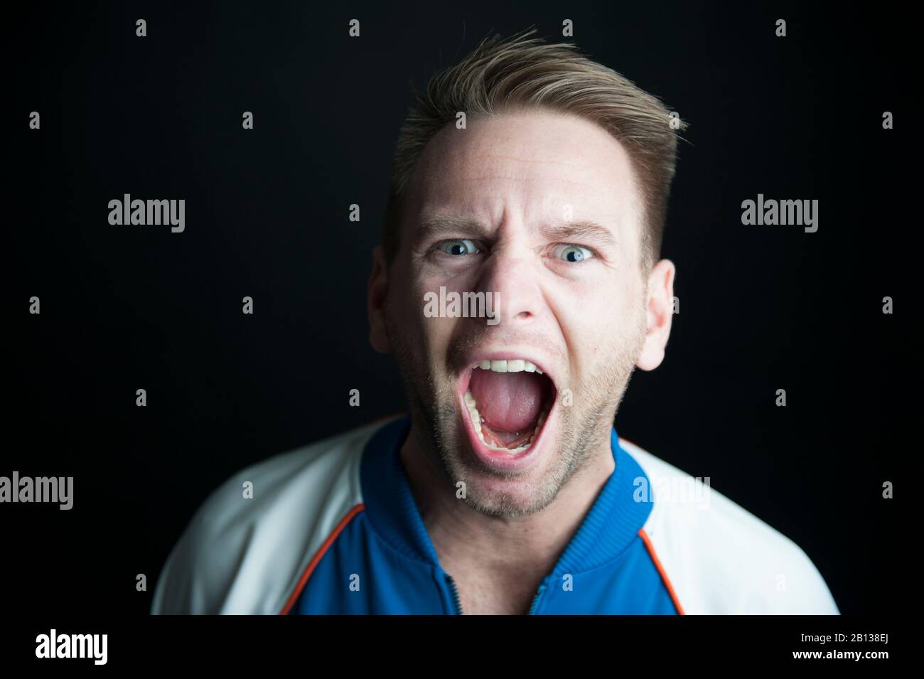 Shouting casual man standing hi-res stock photography and images - Alamy
