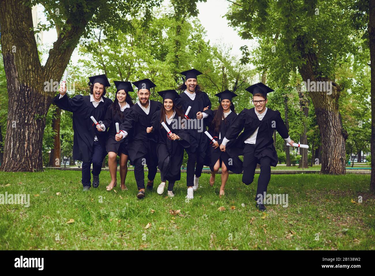 Graduates run hi-res stock photography and images - Alamy