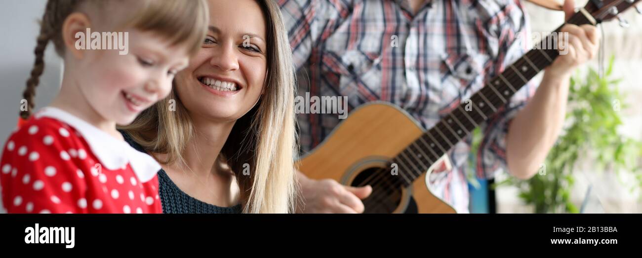 Happy family plays musical instruments on background Stock Photo - Alamy