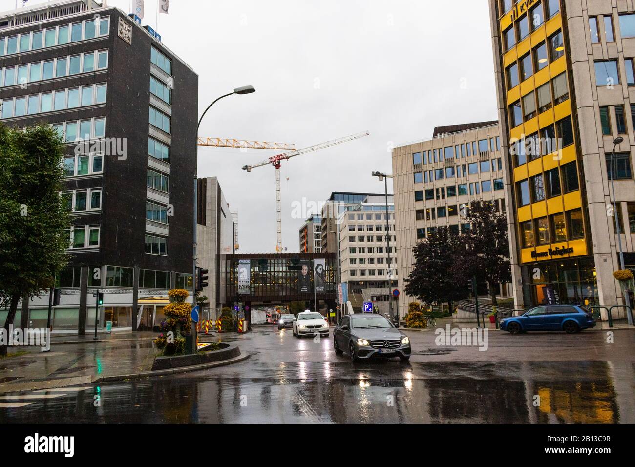 Ring 1 street view with buildings and cars on rainy summer day, Oslo ...
