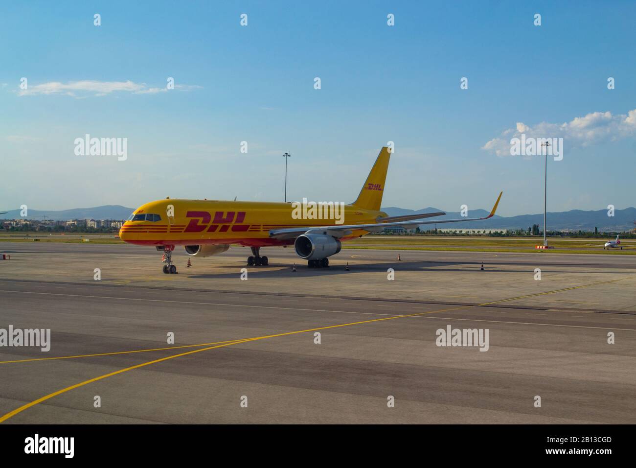 Yellow airplane of DHL at Sofia Airport track.DHL International GmbH is ...