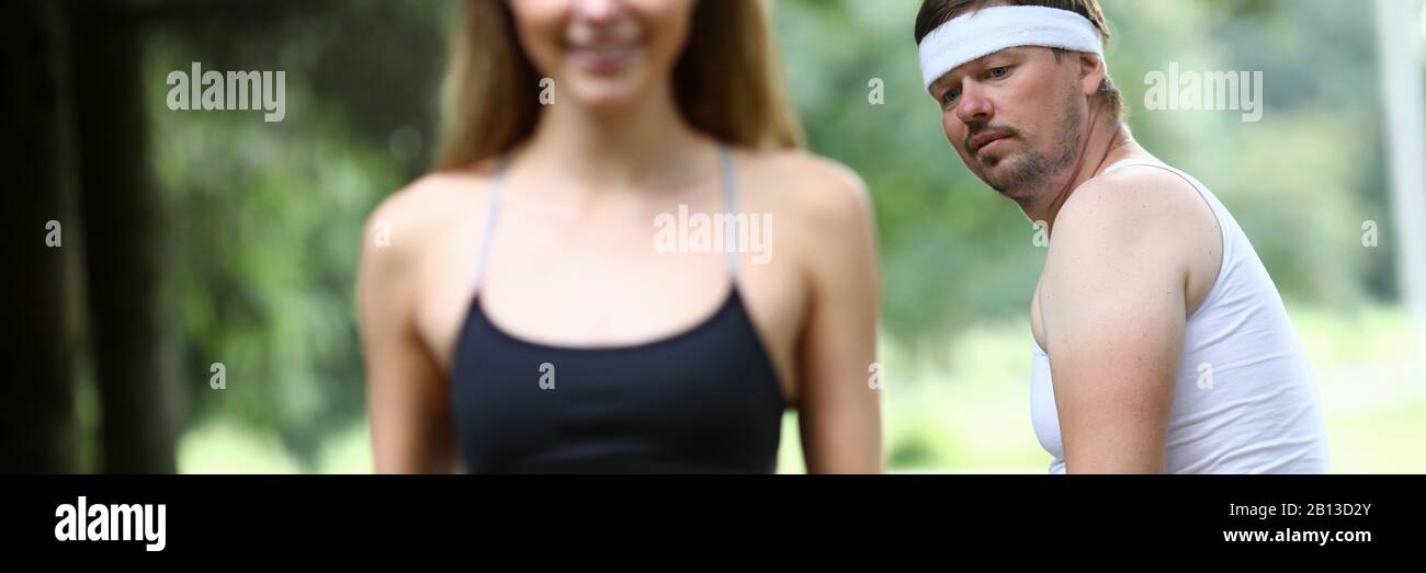 Man turning to look at woman hi-res stock photography and images - Alamy