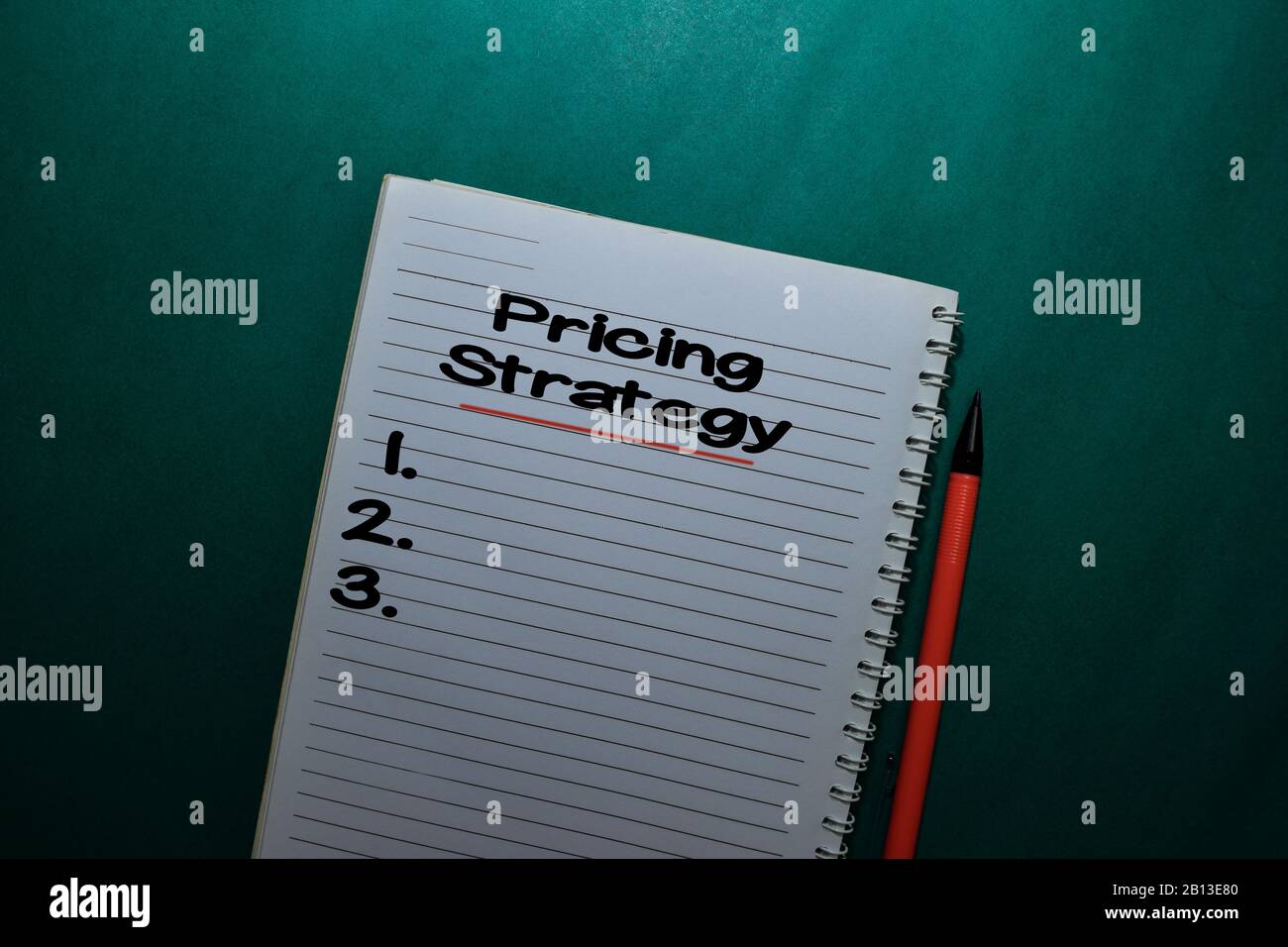 Pricing Strategy and number write on a Book isolated on Office Desk ...