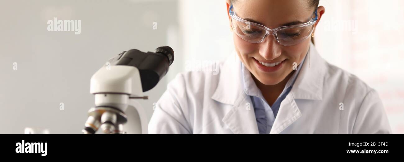 Beautiful woman in white medical gown Stock Photo - Alamy