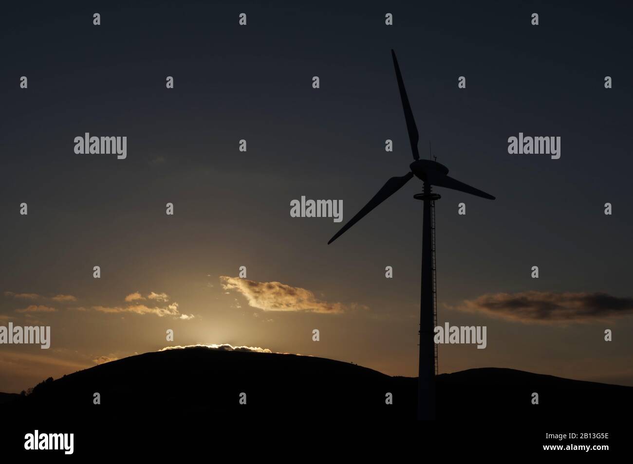 Wind turbine at sunset Stock Photo - Alamy