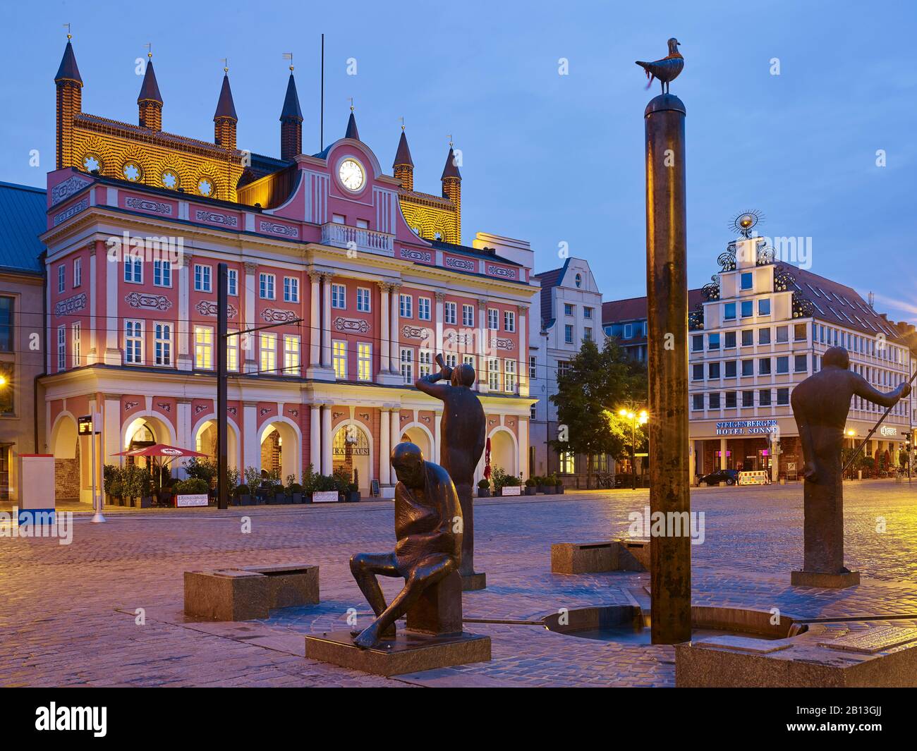 City Hall on New Market Square with Neptune Fountain in Rostock ...