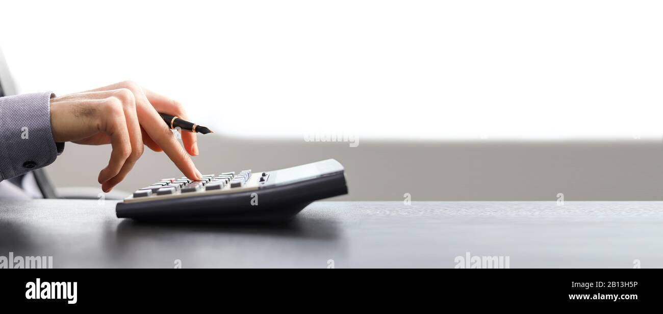 Calculating with calculator hi-res stock photography and images - Alamy