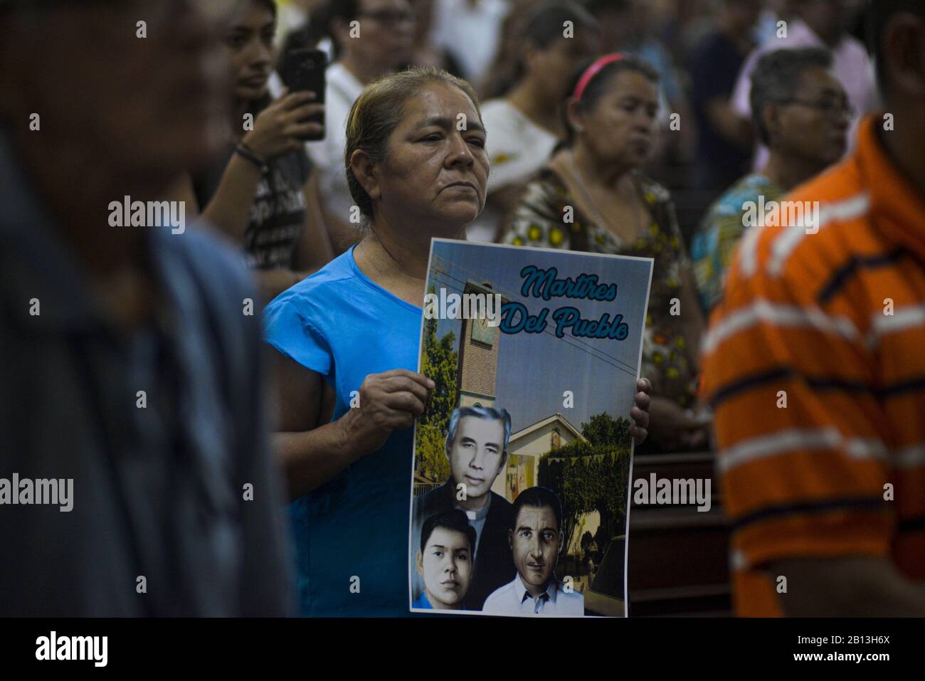 San Salvador, El Salvador. 22nd Feb, 2020. A woman holds a poster of ...