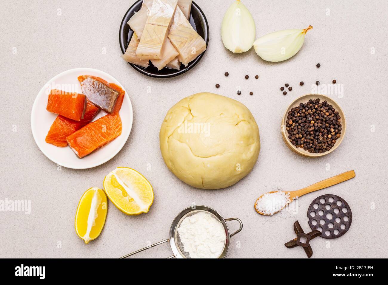 Fish dumplings. Ingredients for home cooking. Fresh dough, fish, spices ...