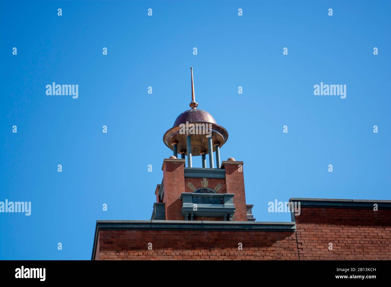Bronze architectural pointed design on brick building Stock Photo - Alamy