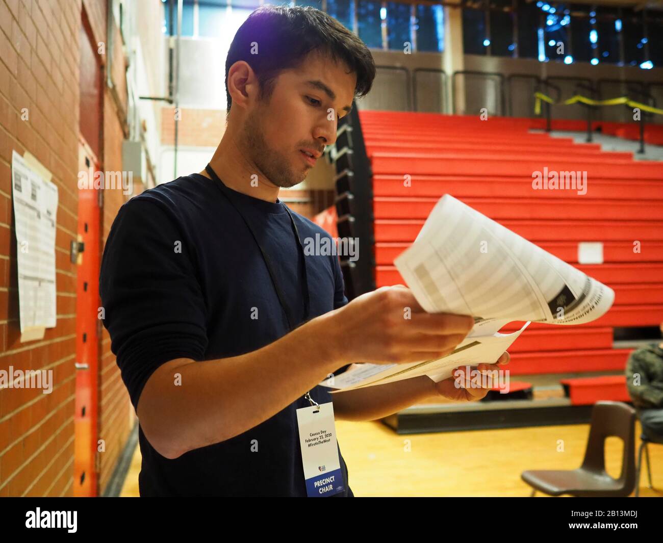 Las Vegas, Nevada, USA. 22nd Feb, 2020. The precinct chair reviews the ...
