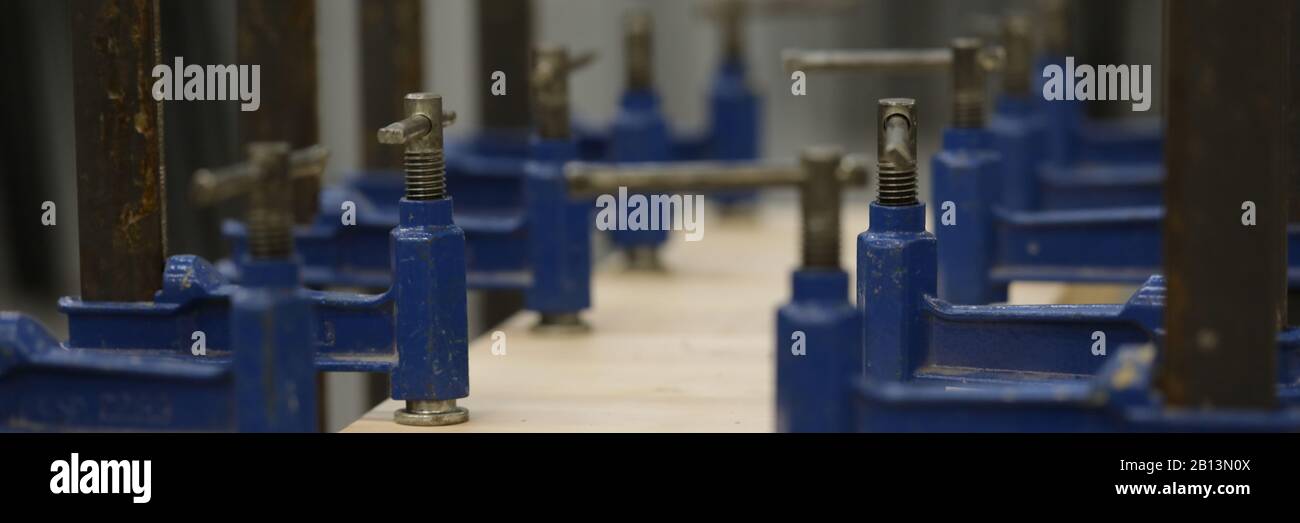 Blue metallic clamps Stock Photo - Alamy
