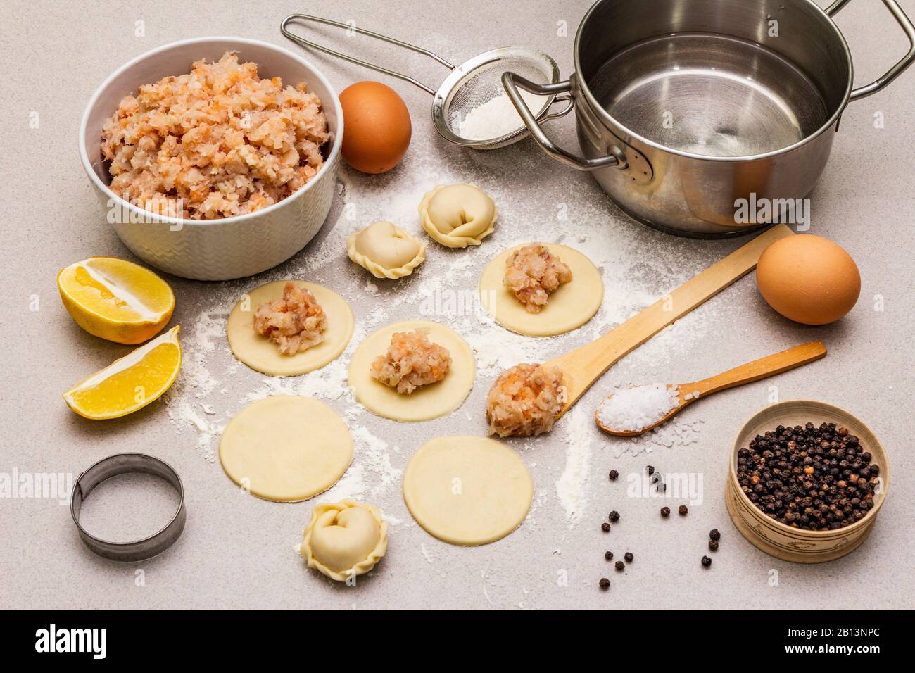 Fish dumplings. Ingredients for home cooking. Fresh dough, fish, spices ...