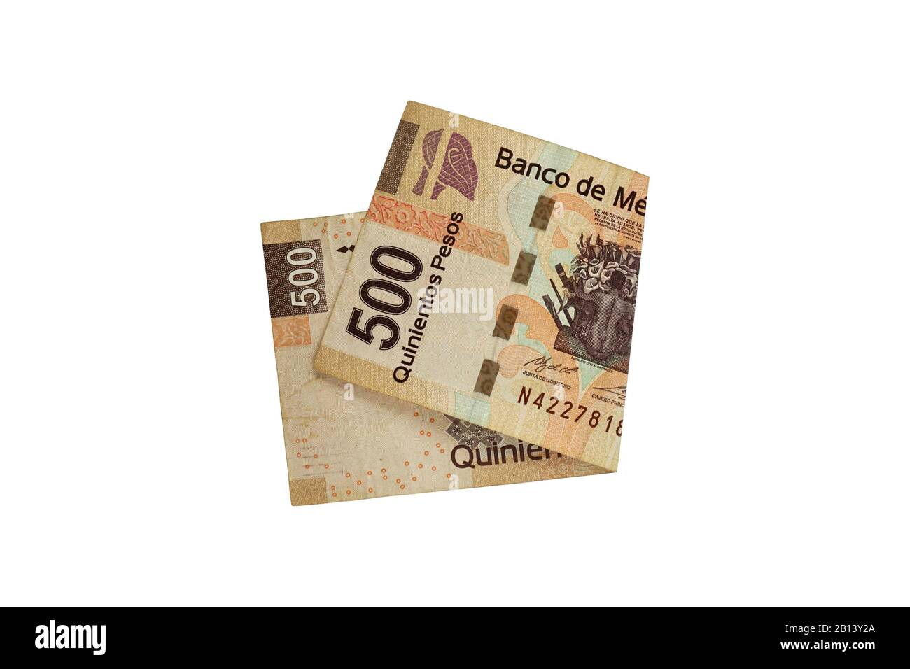 A single middle folded 500 mexican peso bill isolated and on white ...