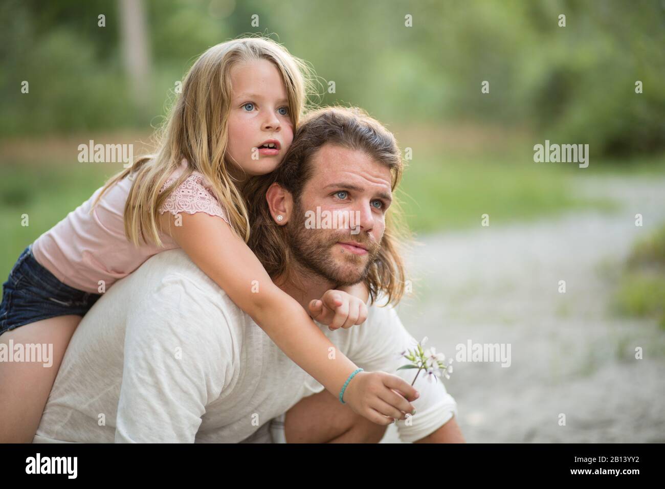 Father cuddling young daughter hi-res stock photography and images - Alamy