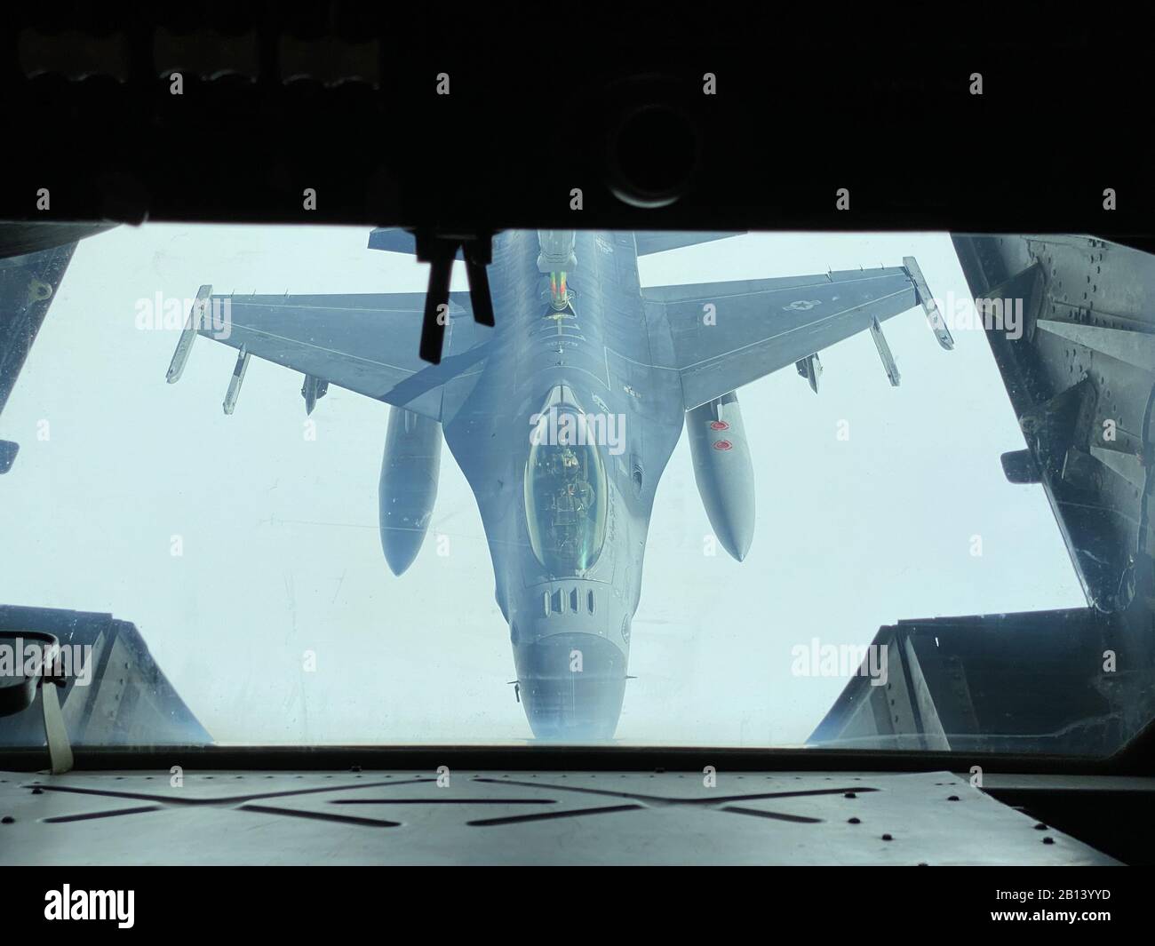 The boom of a KC-10 Extender connects with an F-16 Fighting Falcon Feb ...