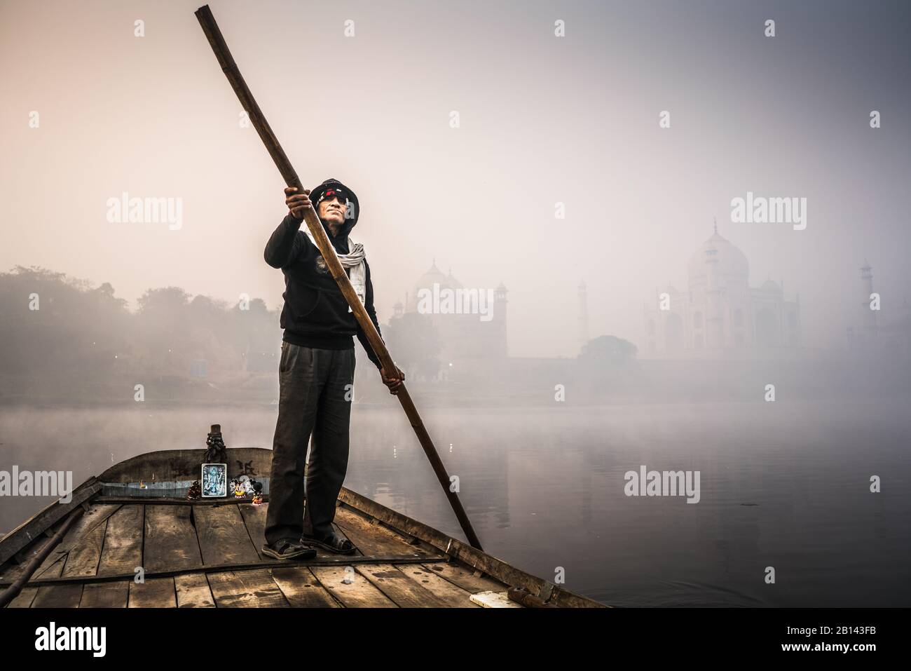 Boatman on the boat with Taj Mahal in the background, Agra, India, Asia ...
