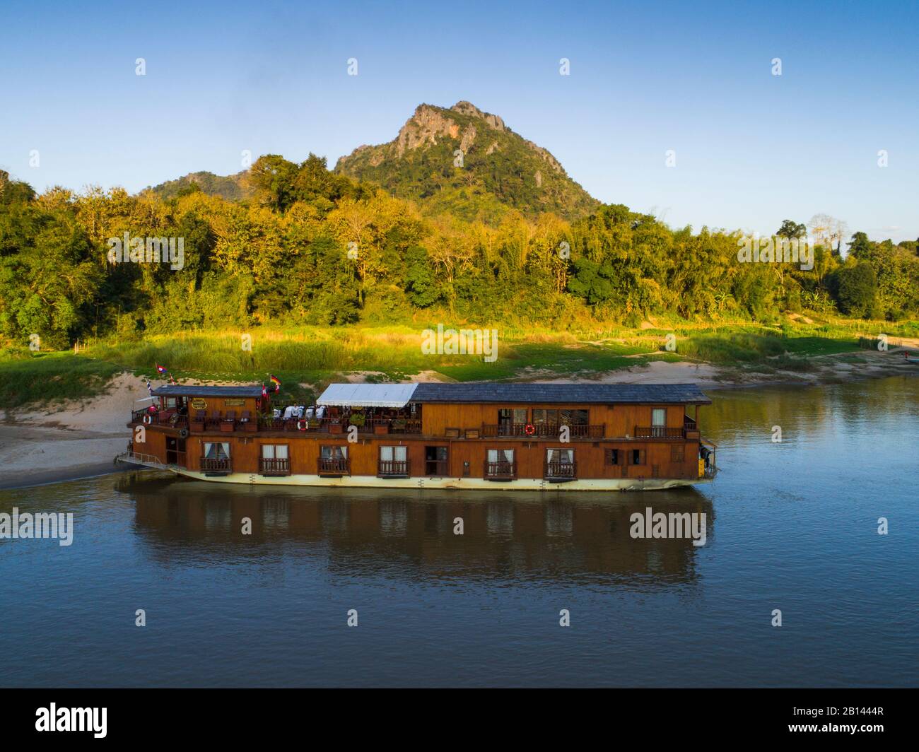 River cruise ship Mekong Sun lies at night on a shore, Laos Stock Photo ...