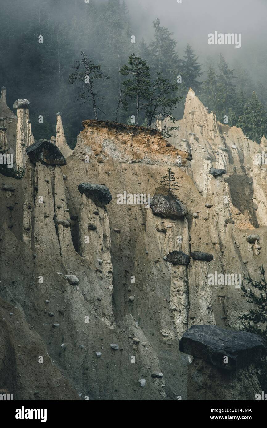 Earth pyramids in the mist, South Tyrol, Italy Stock Photo - Alamy