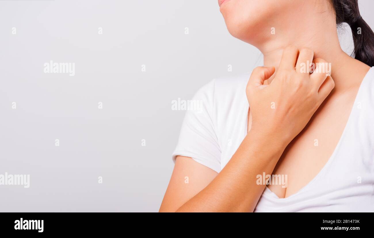 Asian beautiful woman itching her useing hand scratch itch neck on ...