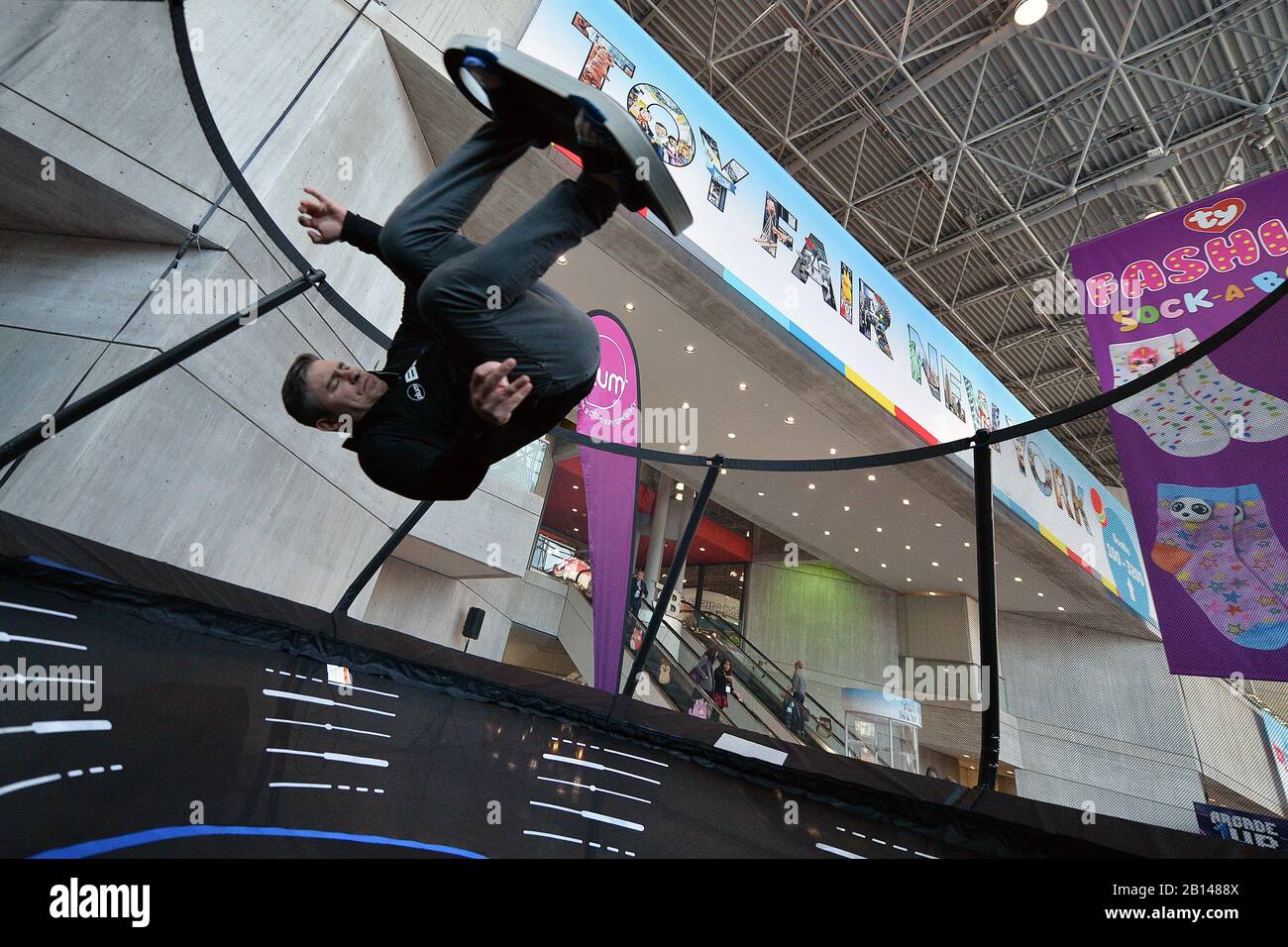 Paul Schaffer demonstrates acrobatic moves on a netted trampoline ...
