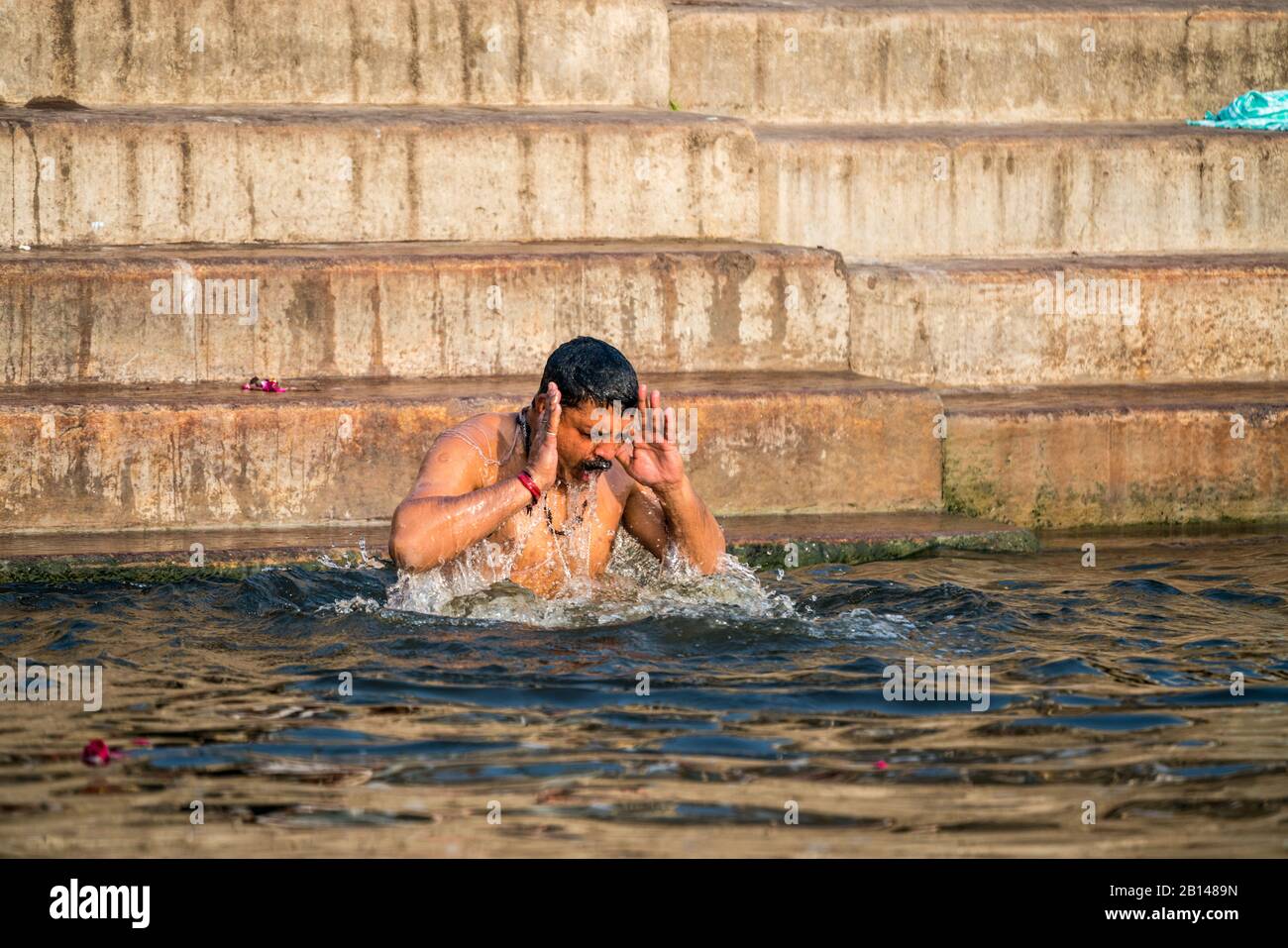 Ganga river bathing people benares hi-res stock photography and images ...