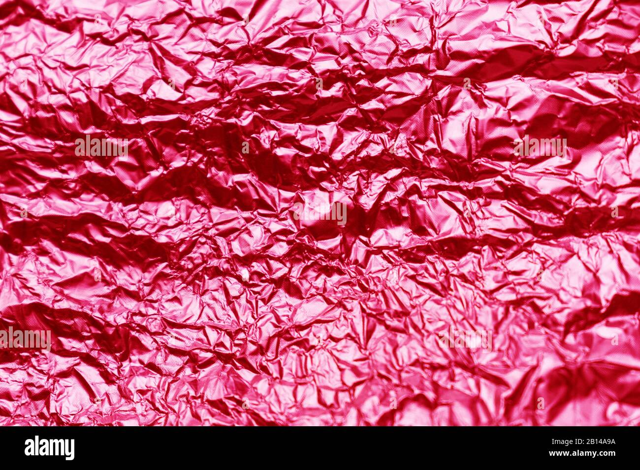 Red texture of crumpled sheet of aluminum foil. Foil background Stock ...