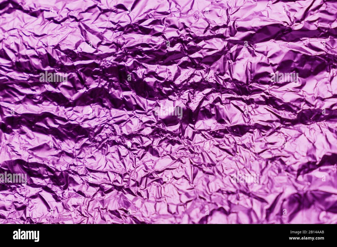 Purple crumpled sheet of aluminum foil. Foil background Stock Photo - Alamy