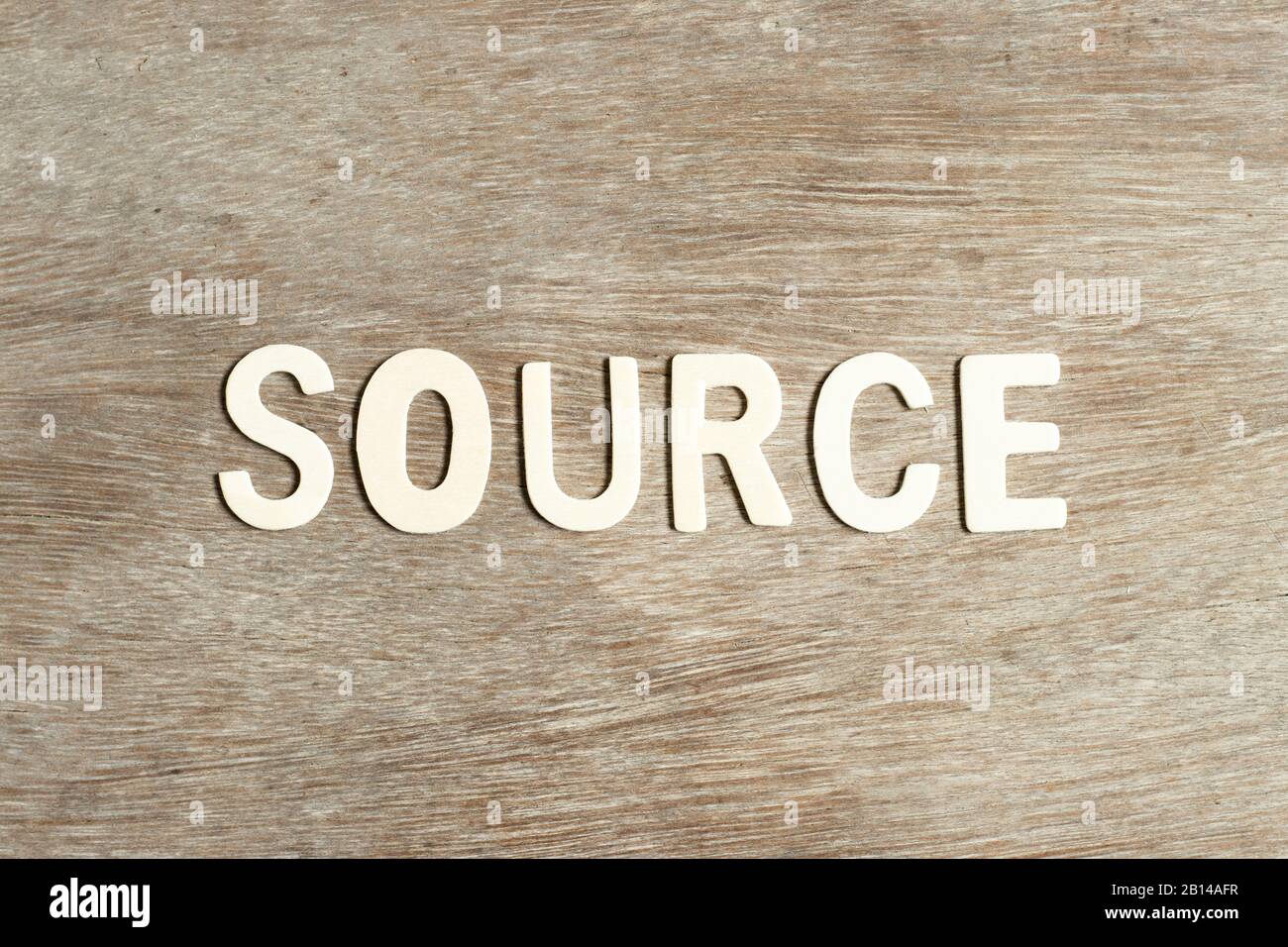 Alphabet letter in word source on wood background Stock Photo - Alamy