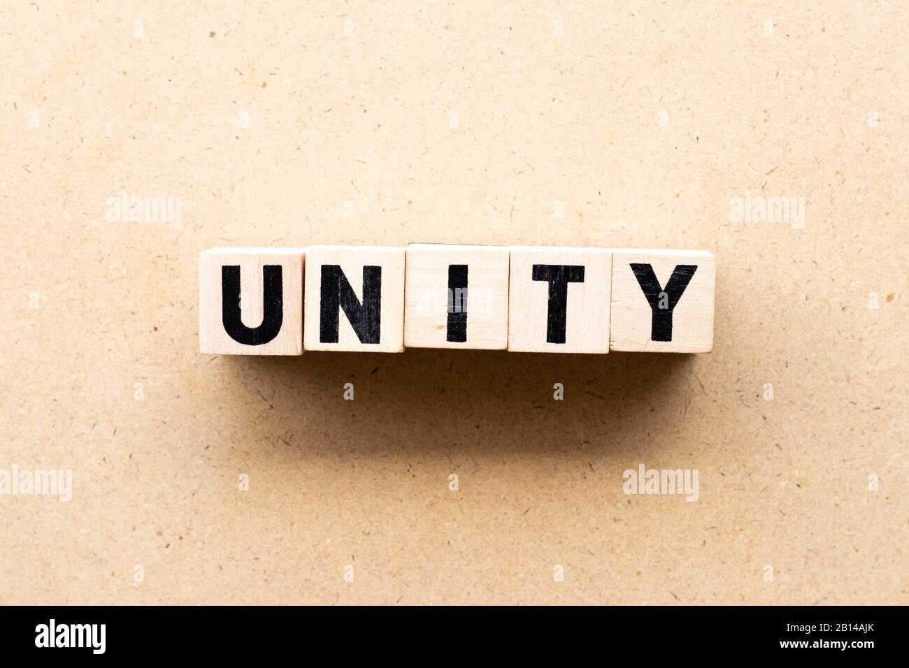 Letter block in word unity on wood background Stock Photo - Alamy