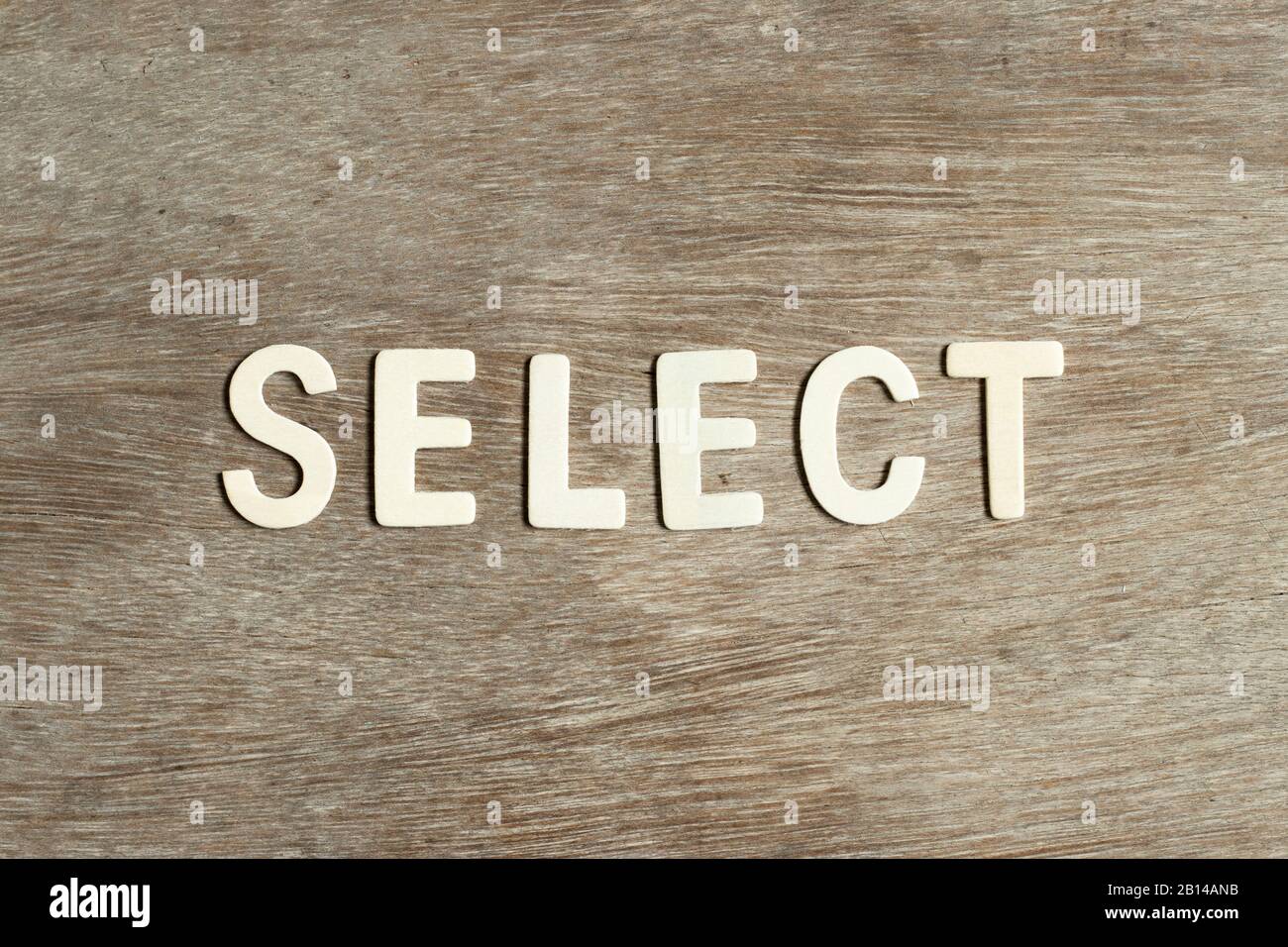 Alphabet letter in word select on wood background Stock Photo - Alamy