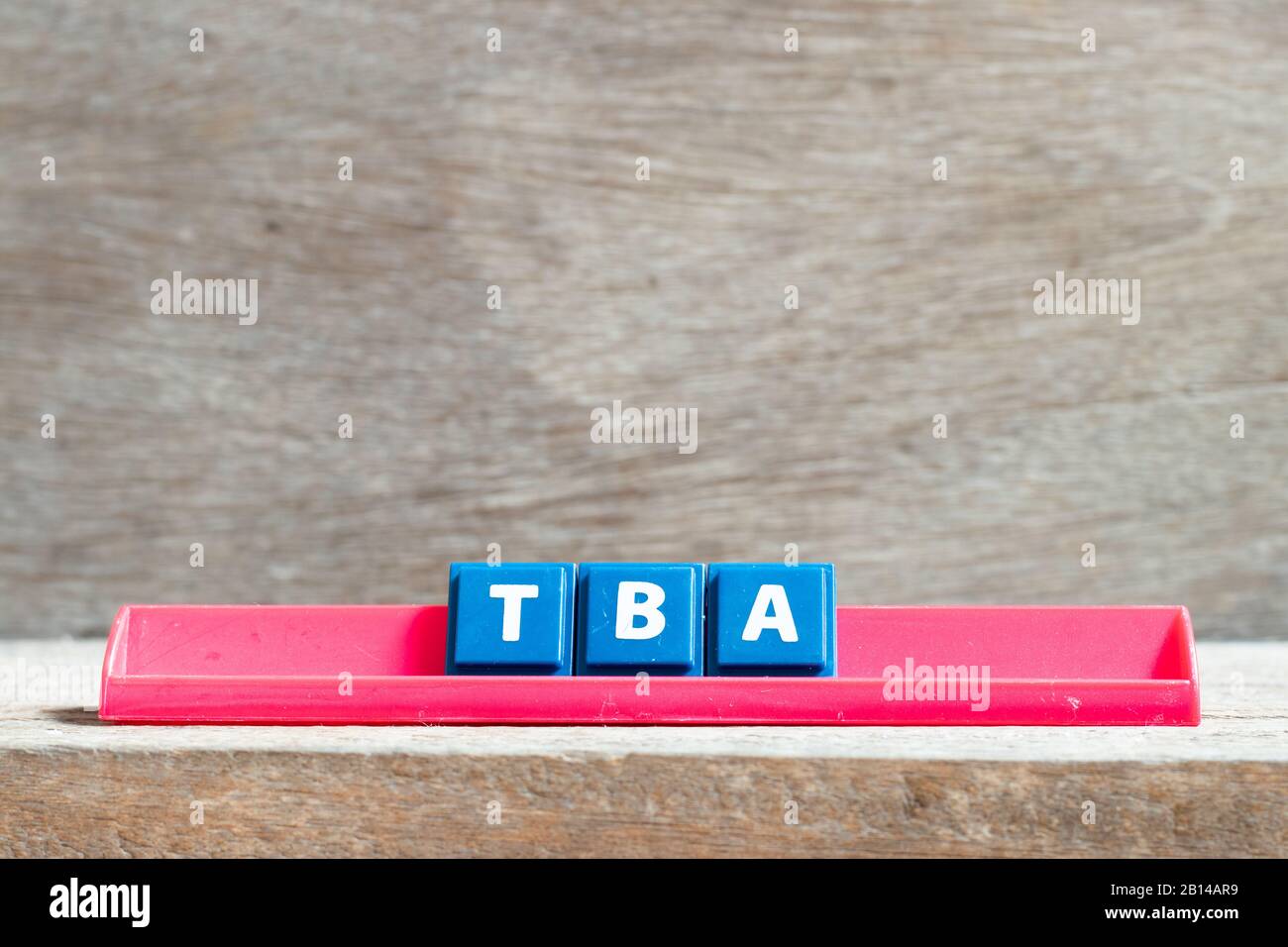 Tile letter on red rack in word TBA (abbreviation of to be announced ...