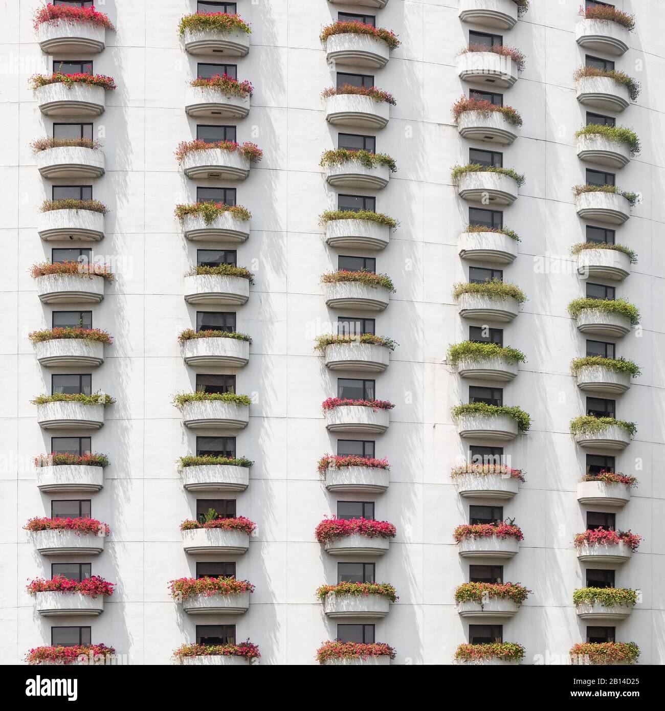 Residential building with balconies covered with flowers Stock Photo ...