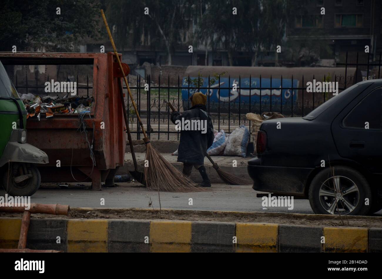 February 11, 2020: Peswahar, Pakistan. 11 February 2020. A child cleans ...