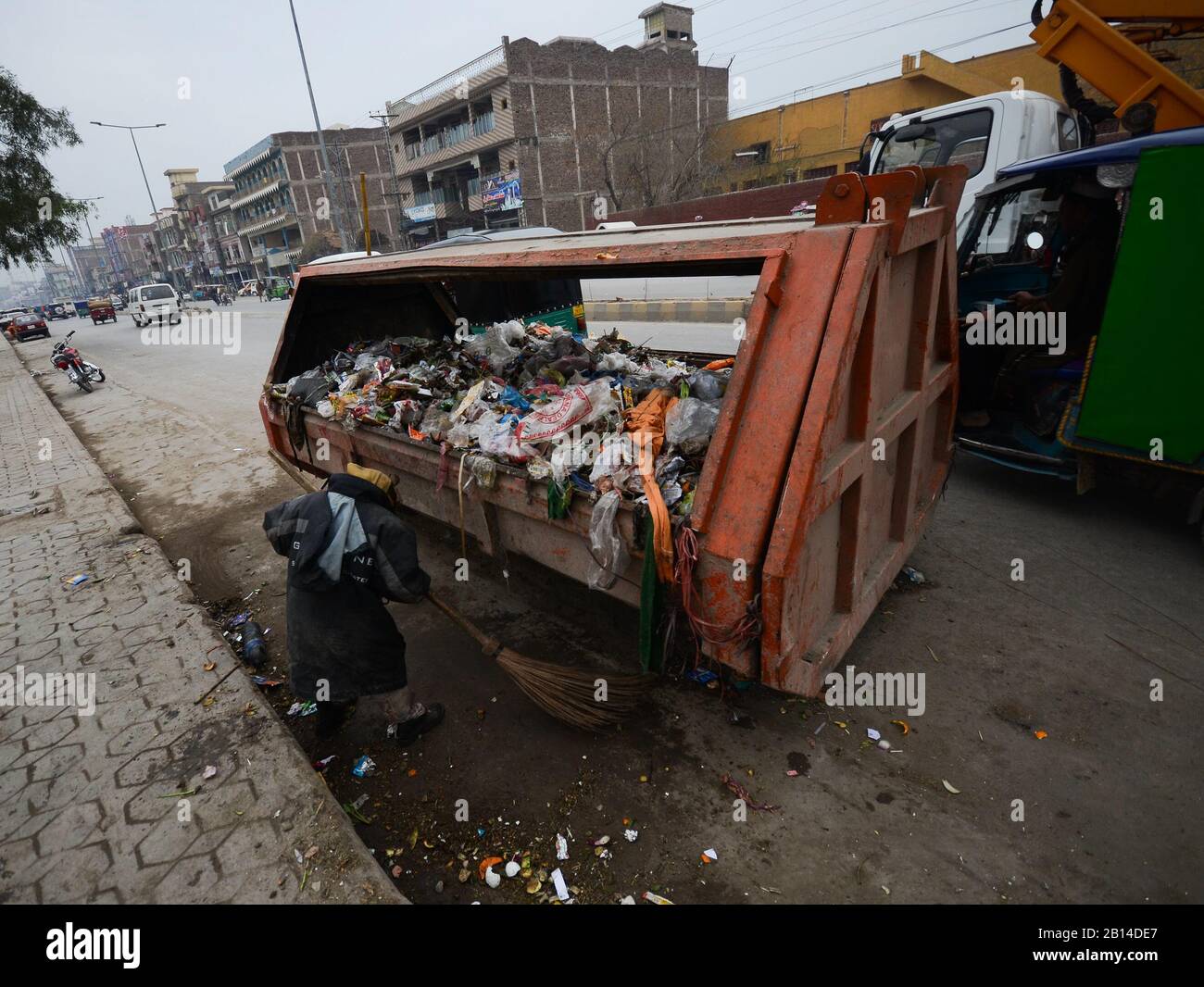 February 11, 2020: Peswahar, Pakistan. 11 February 2020. A child cleans ...