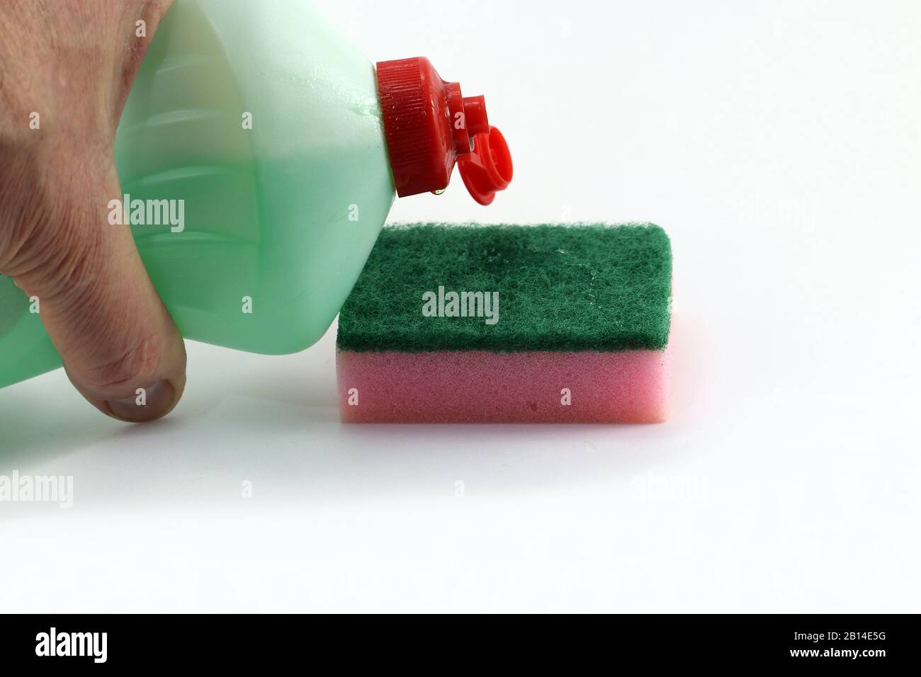 Sponge for washing dishes and dishwashing liquid. Copy space Stock ...
