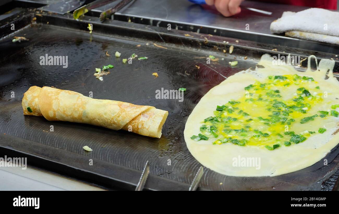 Taiwanese egg crepe roll, a popular street food in Taiwan Stock Photo ...