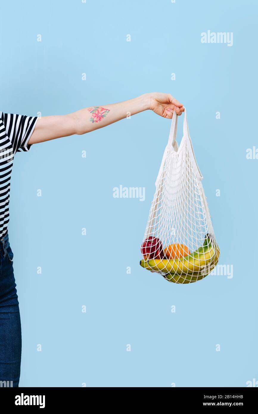 Girl holding a bag net hi-res stock photography and images - Alamy