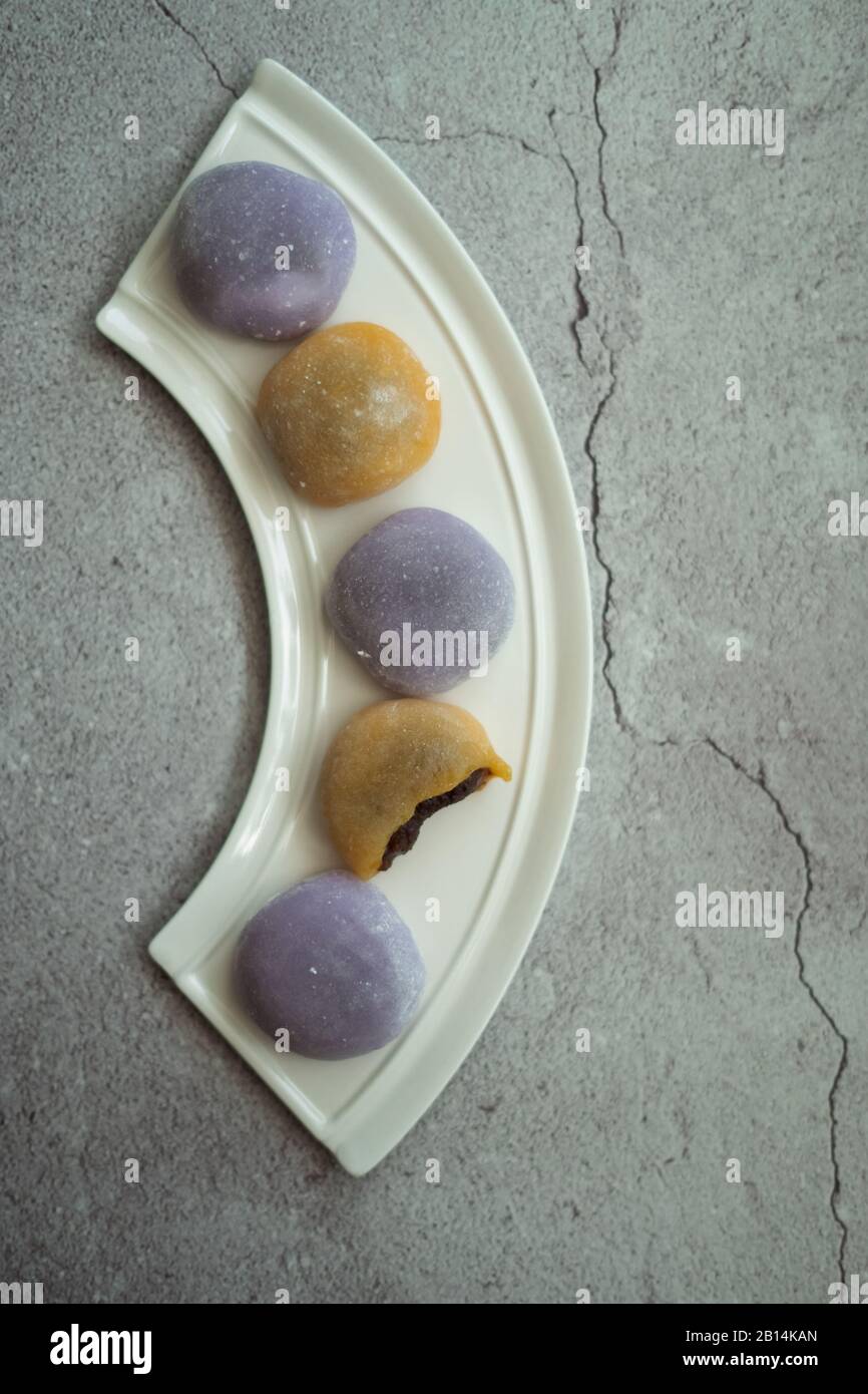 Multi-colored Japanese Mochi in rice dough and on a beautiful plate and ...