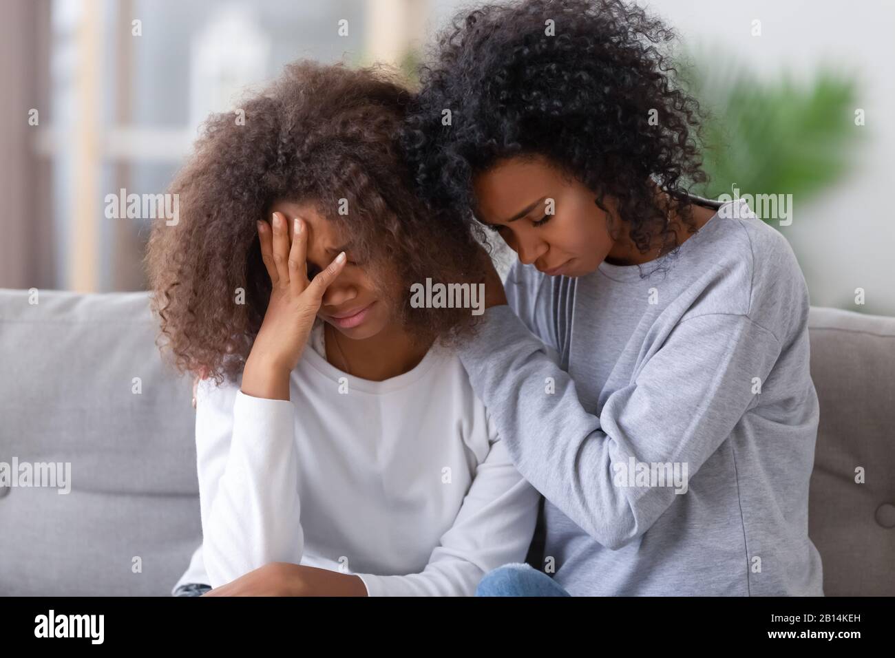 Mother hugging teenager and sad hi-res stock photography and images - Alamy