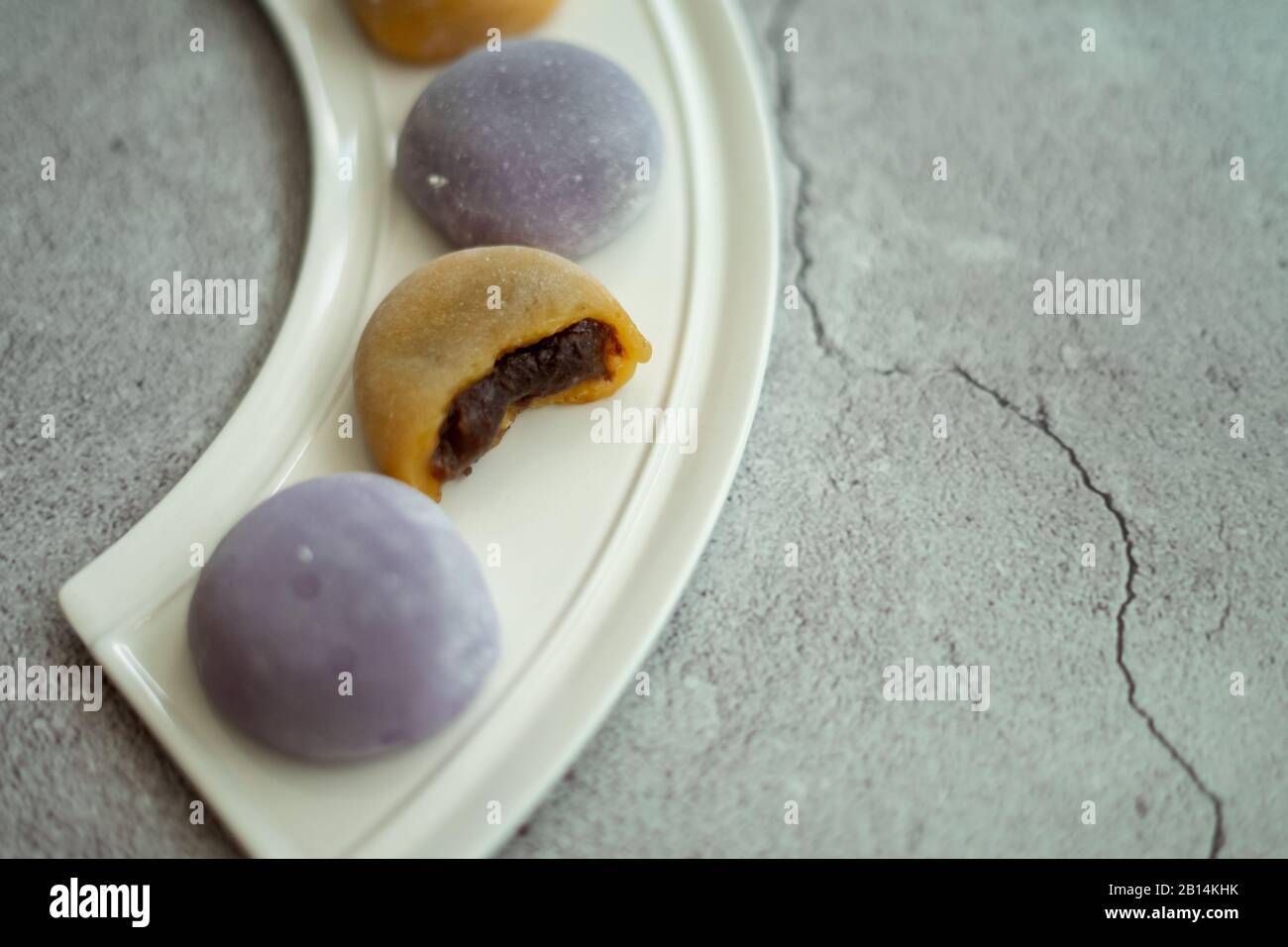 Multi-colored Japanese Mochi in rice dough and on a beautiful plate and ...