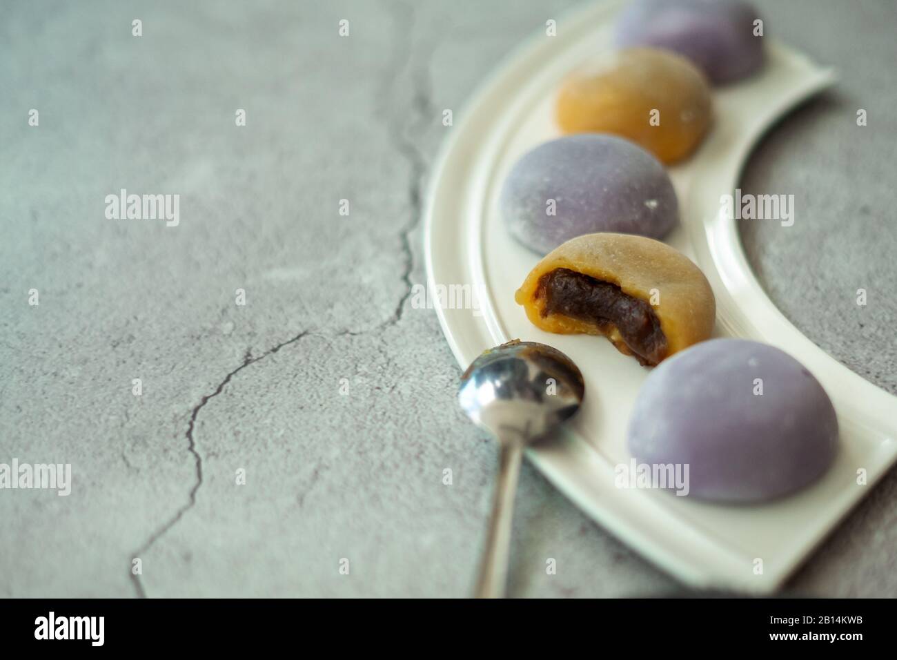 Multi-colored Japanese Mochi in rice dough and on a beautiful plate and ...