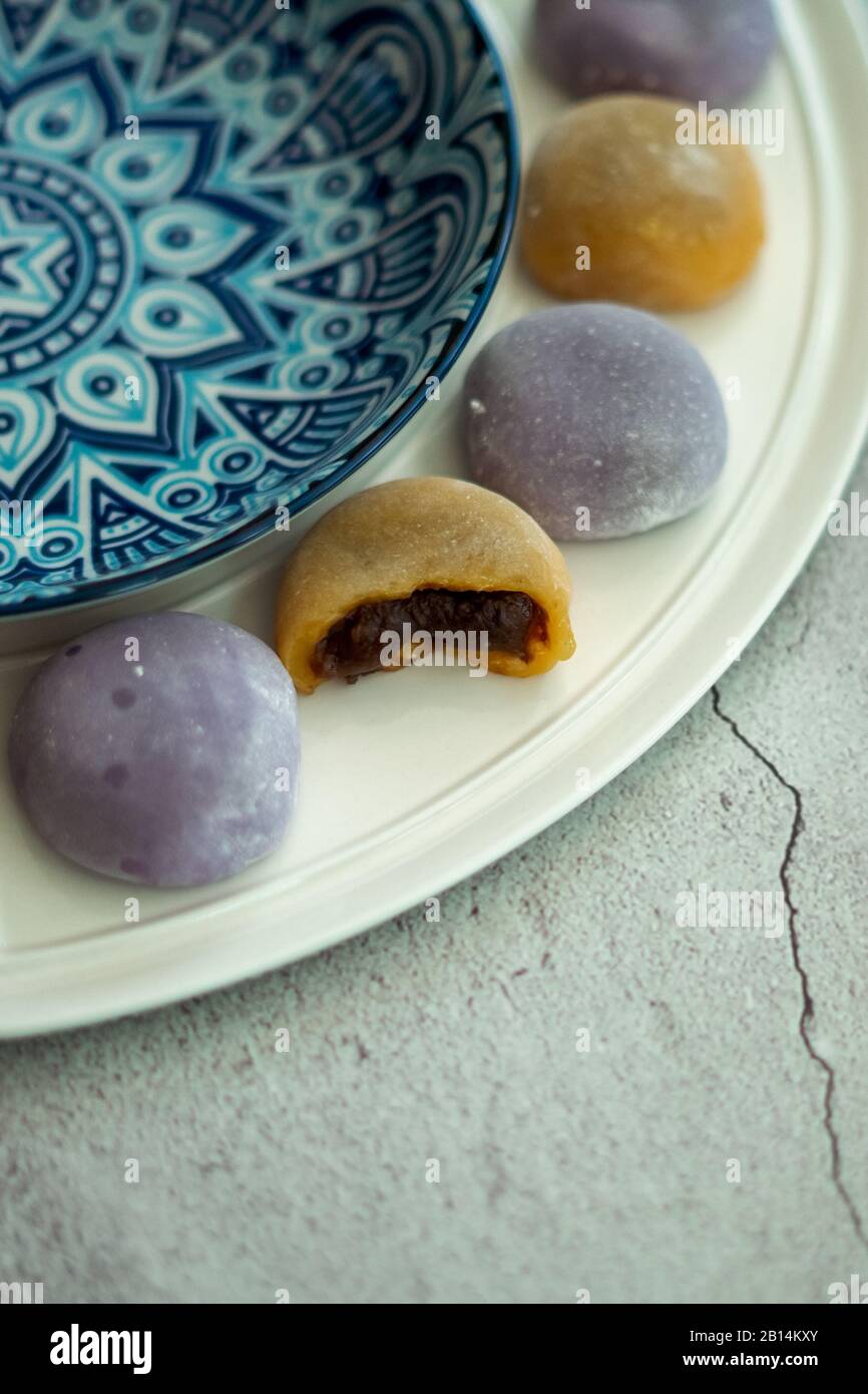 Multi-colored Japanese Mochi in rice dough and on a beautiful plate and ...