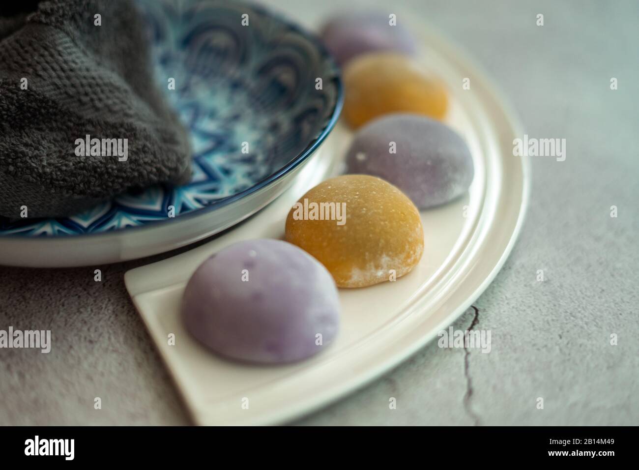 Multi-colored Japanese Mochi in rice dough and on a beautiful plate and ...